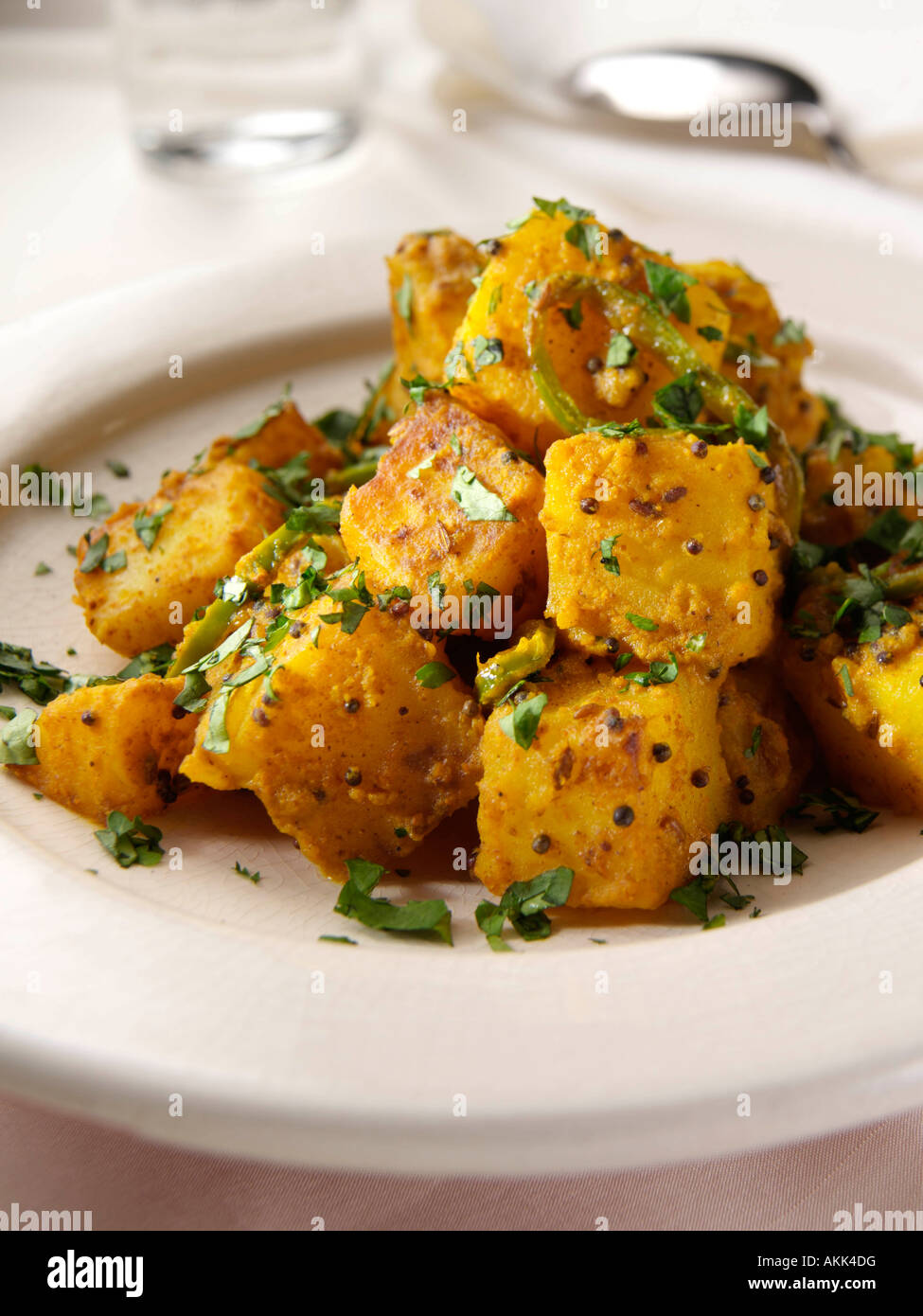 A plate of Indian Aloo Zeera spicy potatoes vegetarian editorial food ...