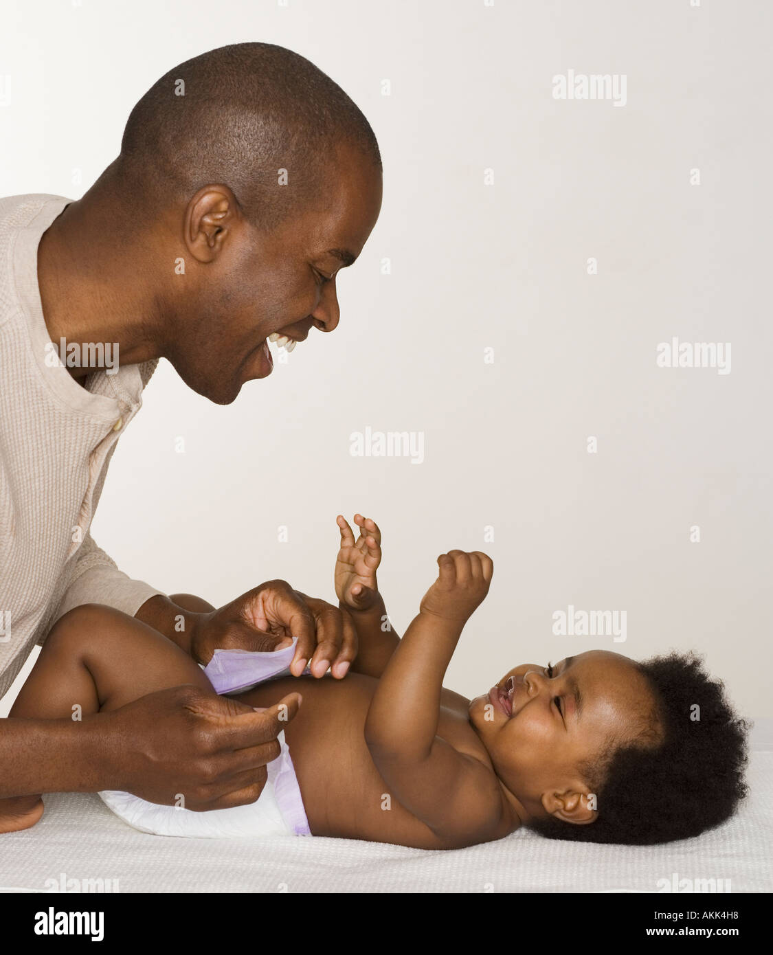 Man changing diaper vertical hi-res stock photography and images - Alamy
