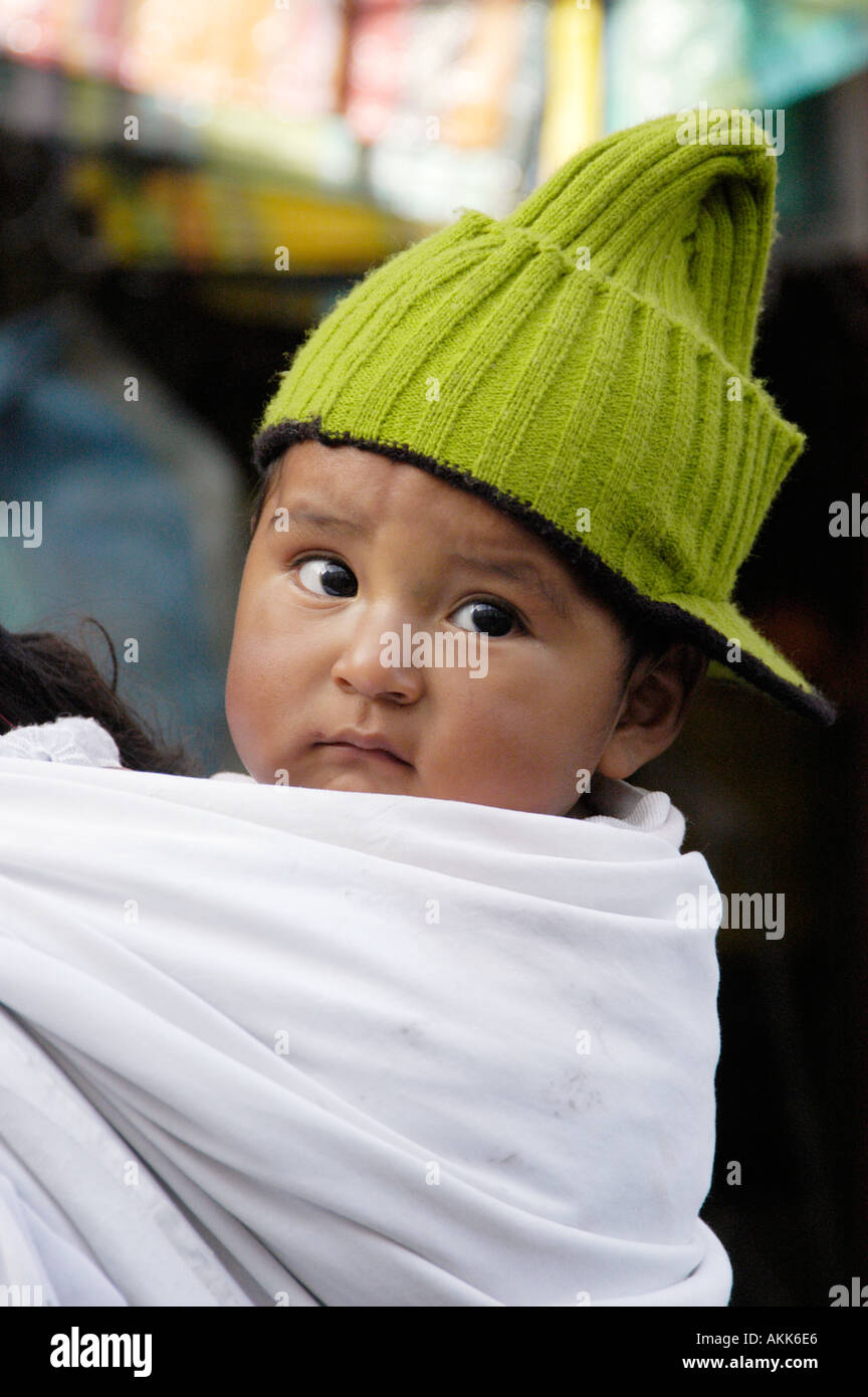 Quechua Indian baby in sling at Otavalo Market, Ecuador, South America ...