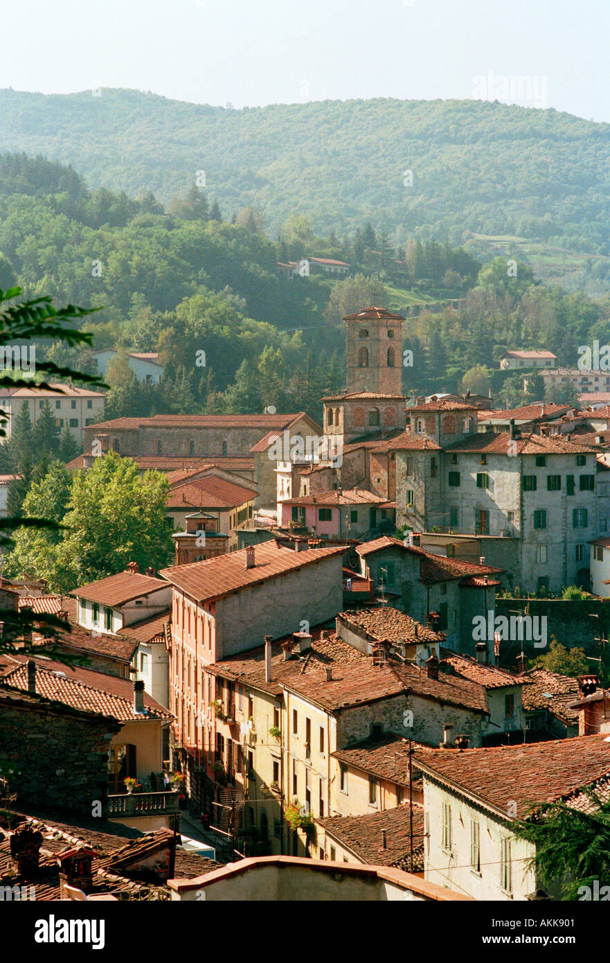 A view over an old Tuscan hill village in Italy showing the typical red ...