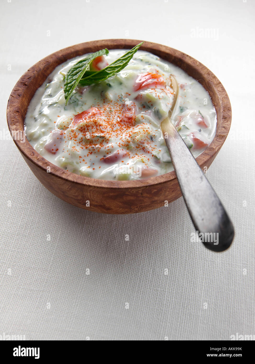 A dish of Indian cucumber and tomato raita vegetarian editorial food ...