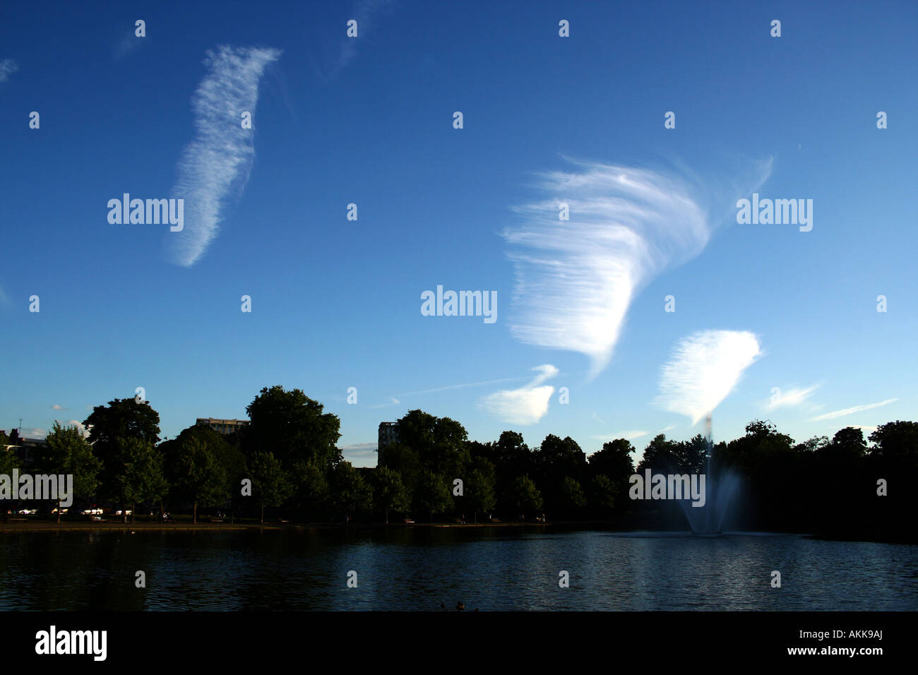 Strange cloud formations over lake in Victoria Park, East London Stock ...