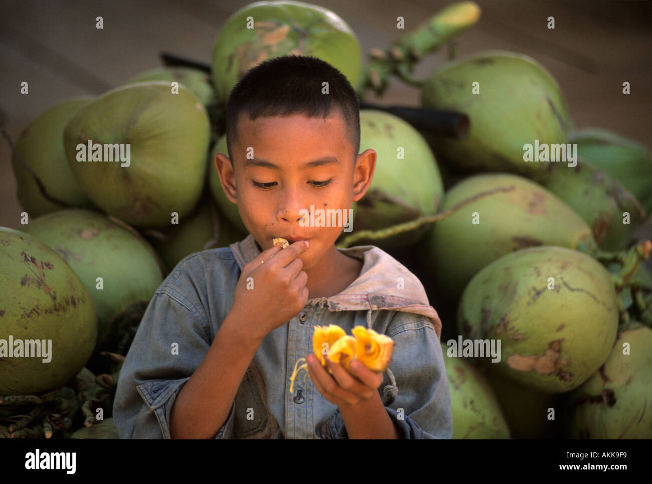 Boy with coconuts hi-res stock photography and images - Alamy