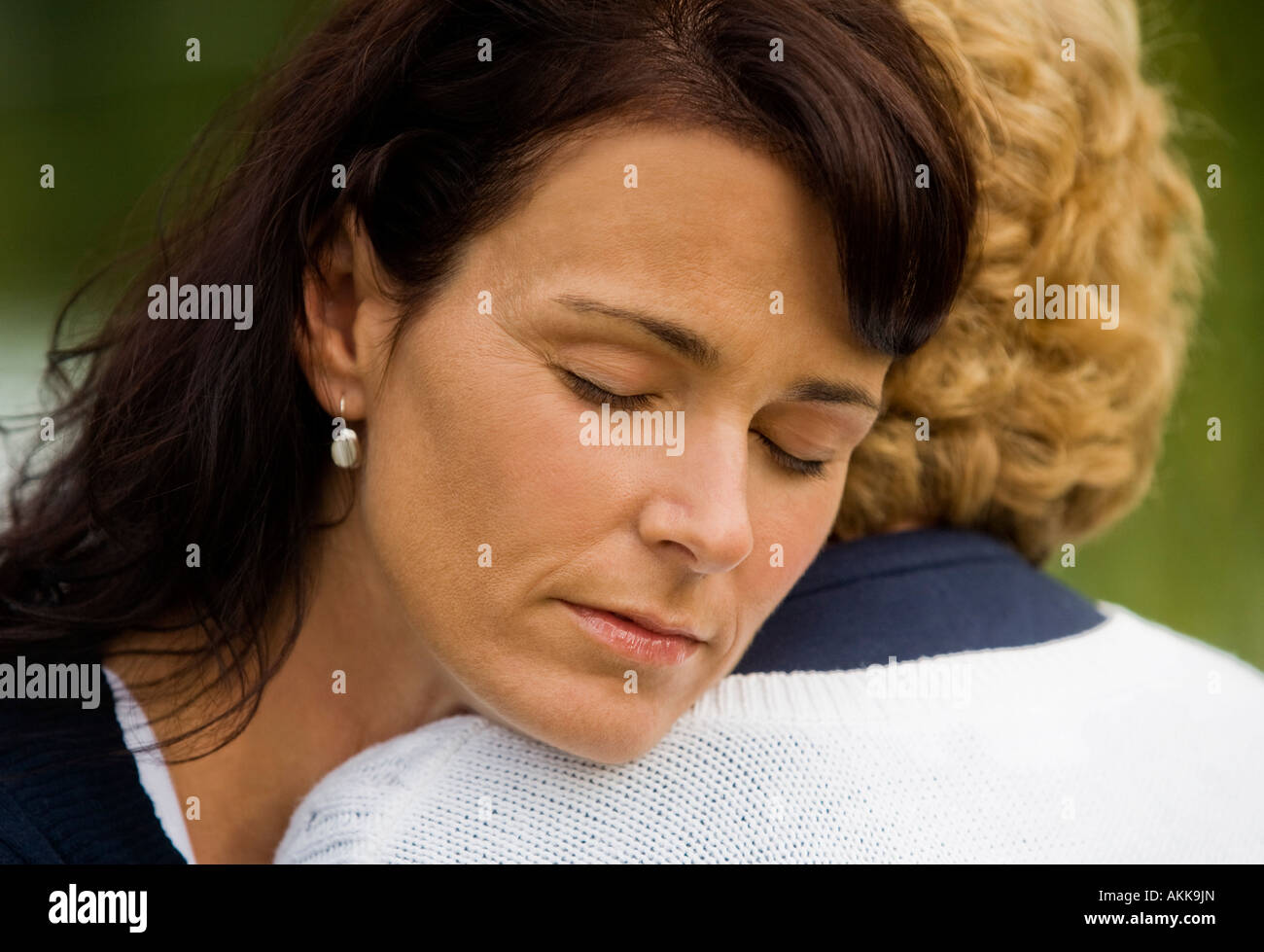 Two people comforting hugging hi-res stock photography and images - Alamy