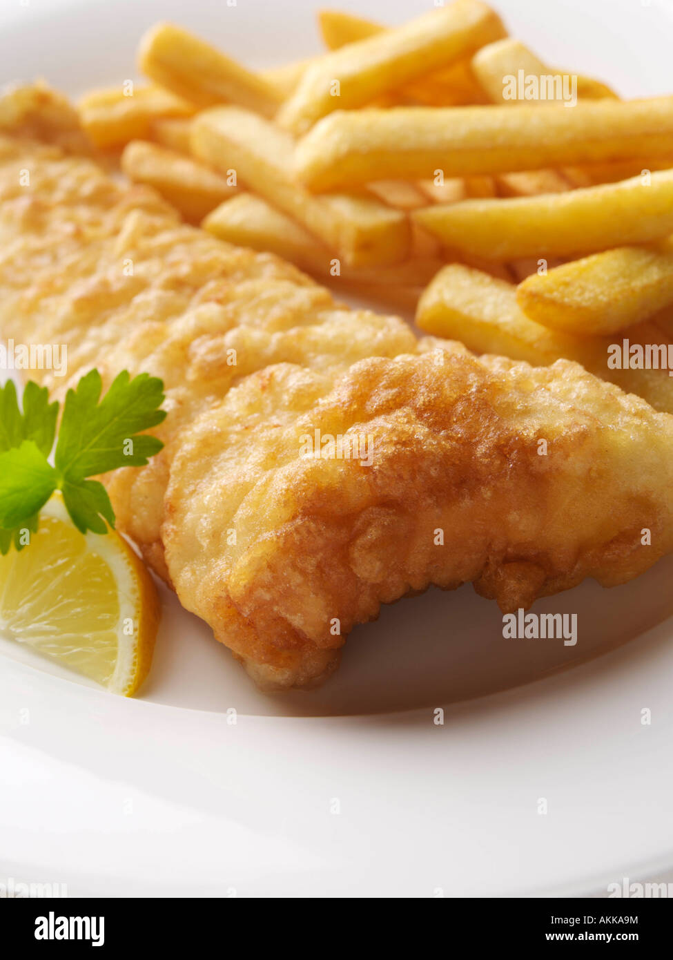 Individual portion deep fried battered fish and chips hi-res stock ...
