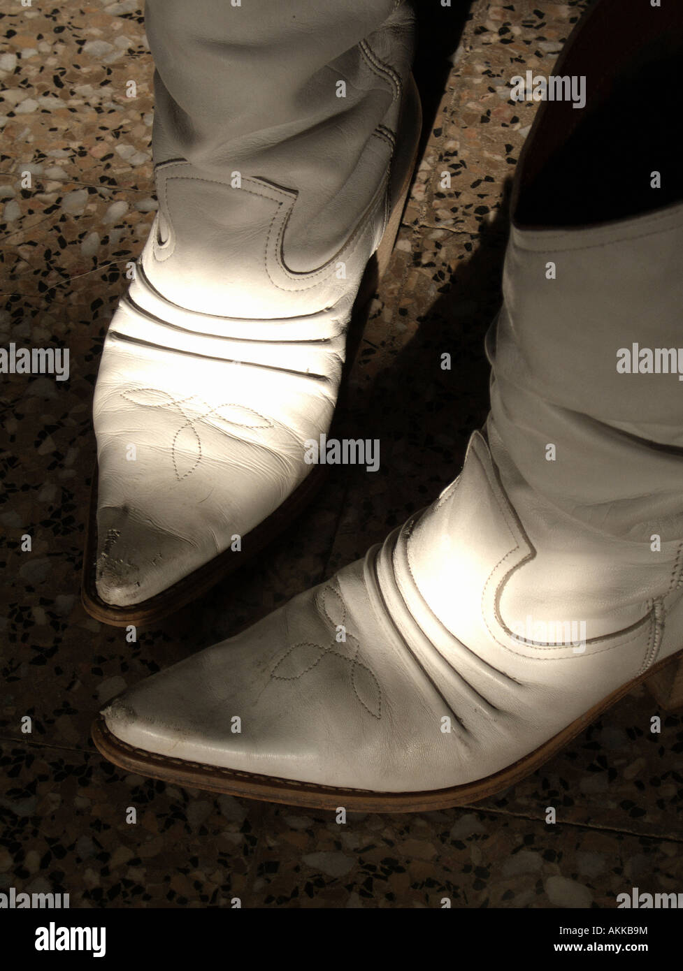 Girl wearing cowboy boots hi-res stock photography and images - Alamy