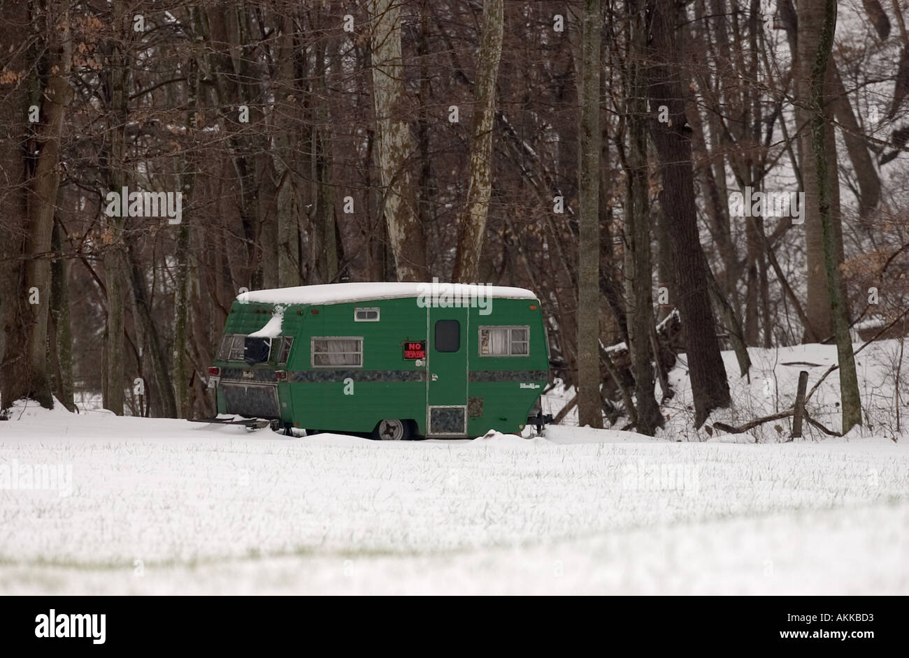 Green camper in snowy field Stock Photo - Alamy