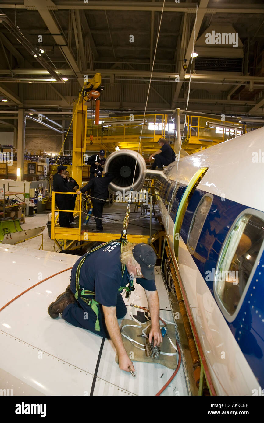 Workers do heavy maintenance on American Eagle Embraer jet airplanes at ...