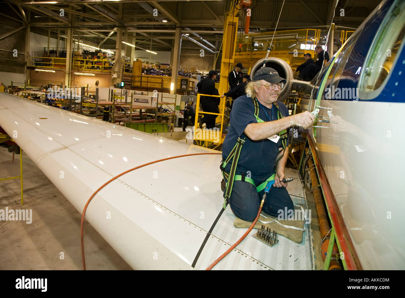 Workers do heavy maintenance on American Eagle Embraer jet airplanes at ...