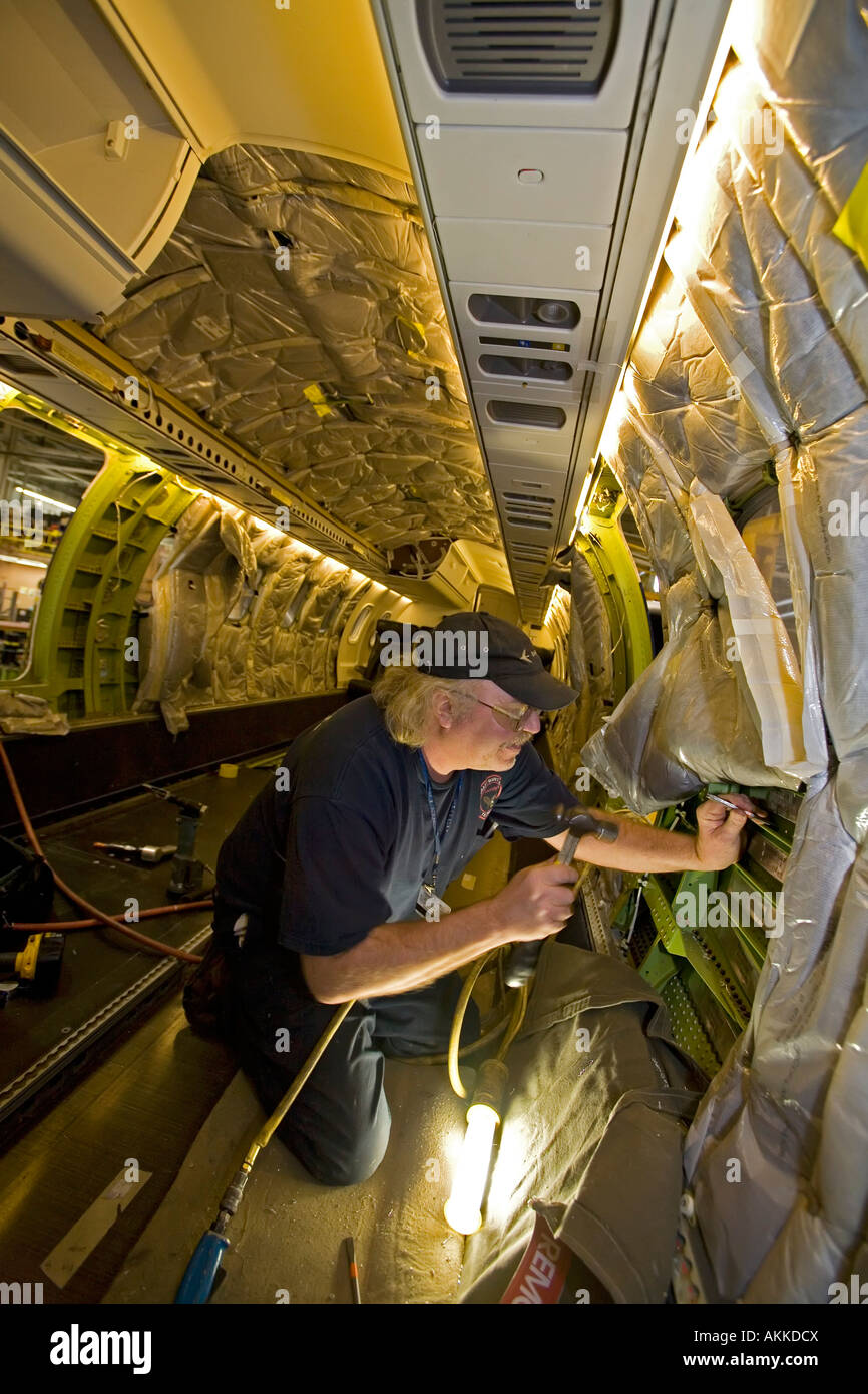 Workers do heavy maintenance on American Eagle Embraer jet airplanes at ...