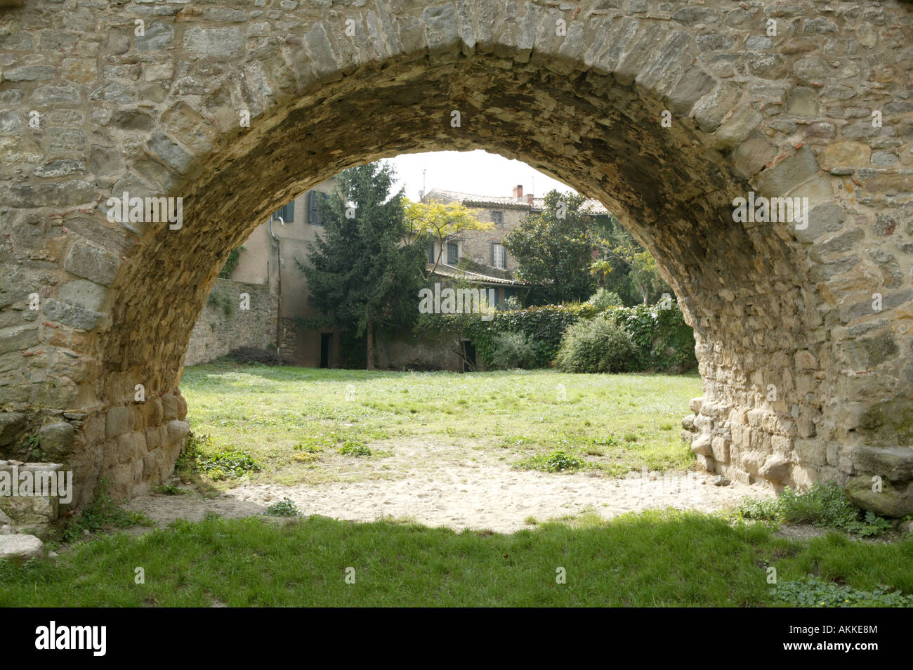 a historic bridge arch of traditional construction over a previous moat ...