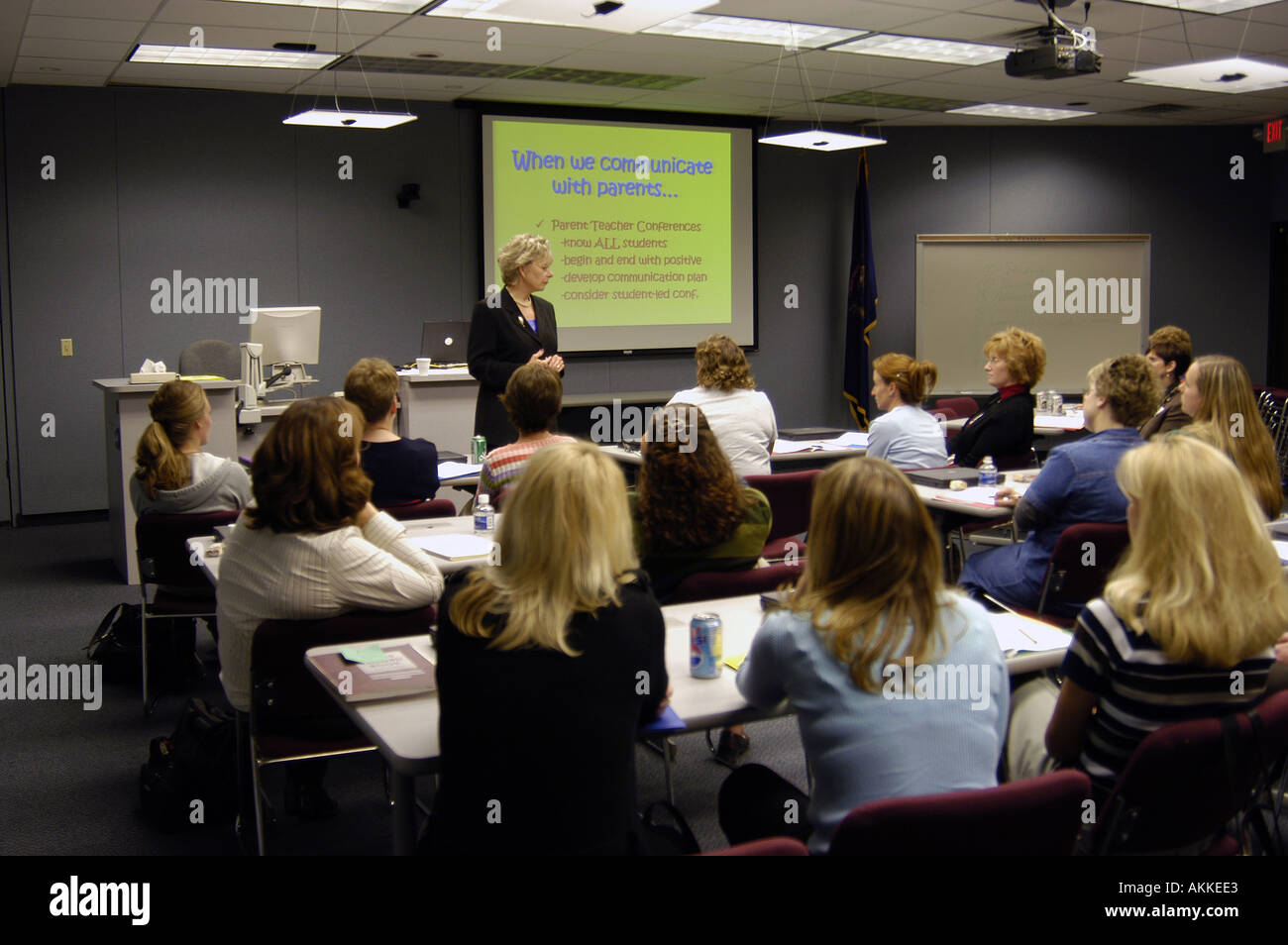 Female presenter gives Power Point presentation to a group of ...