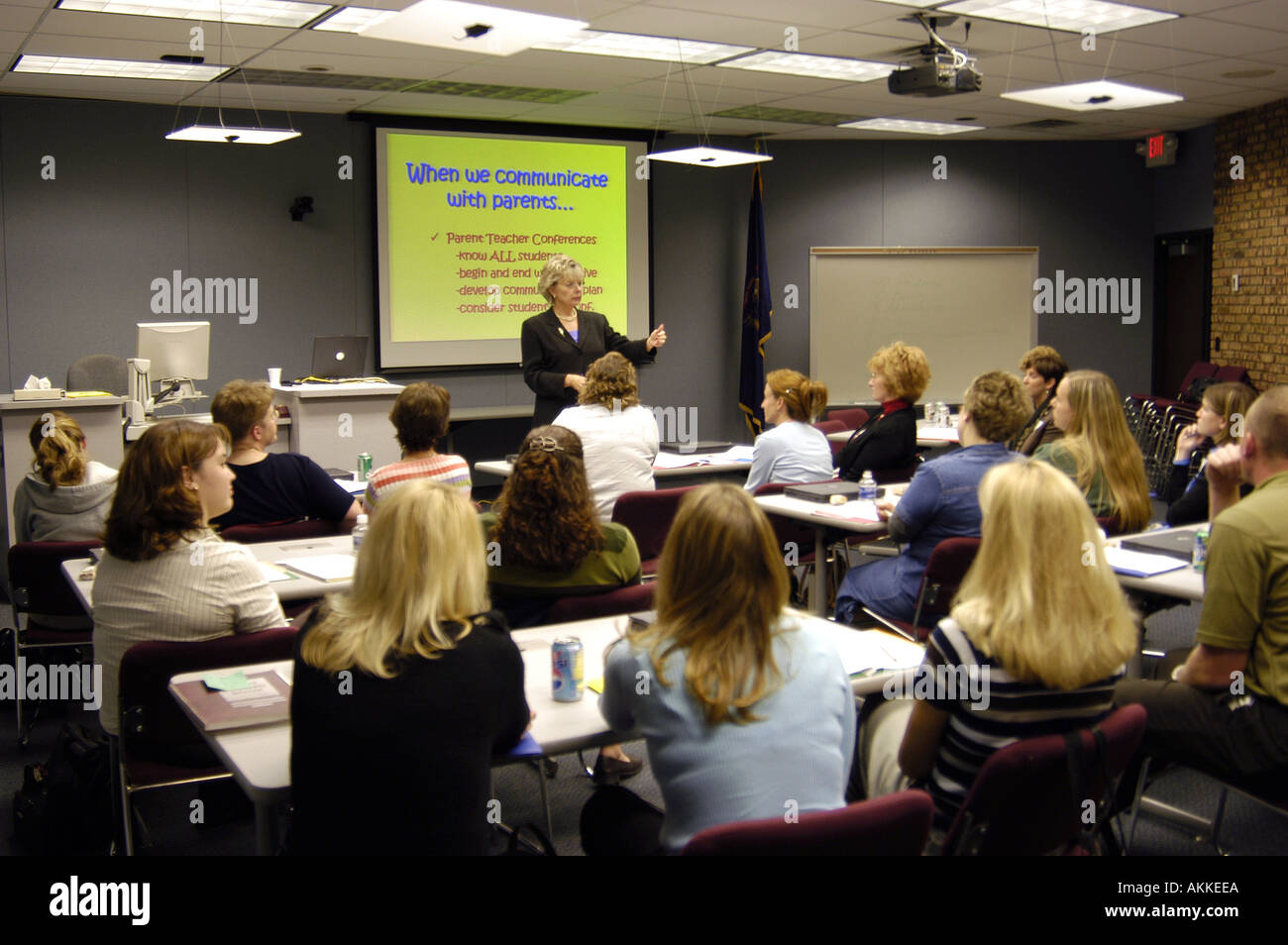 Female presenter gives Power Point presentation to a group of ...