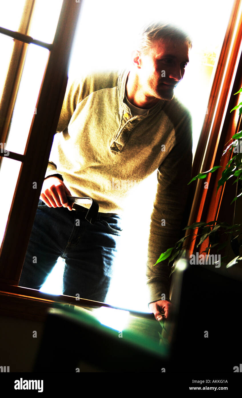 Man breaking into home Stock Photo - Alamy