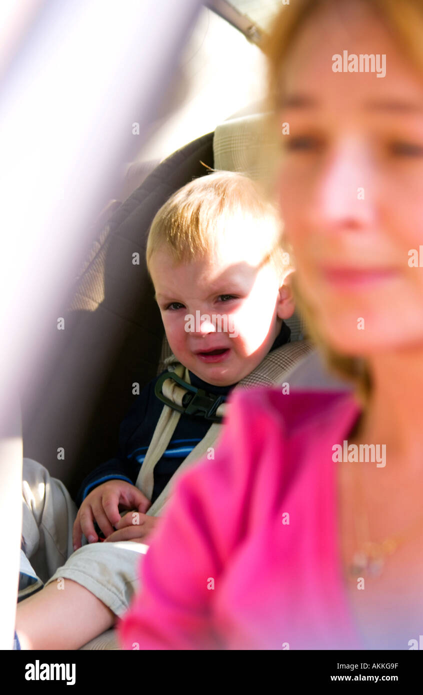 Child crying car seat hi-res stock photography and images - Alamy