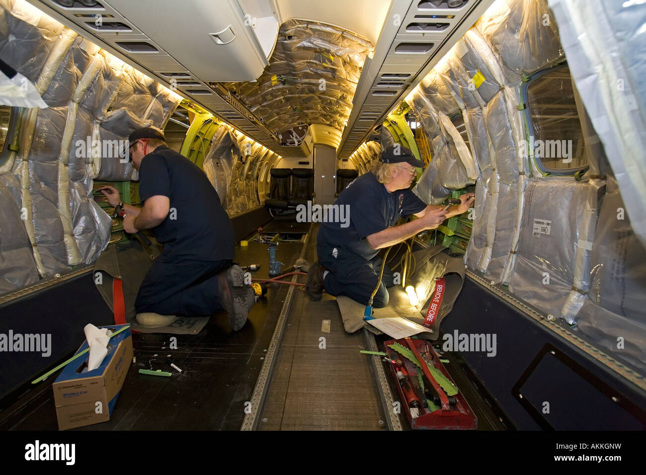 Workers do heavy maintenance on American Eagle Embraer jet airplanes at ...