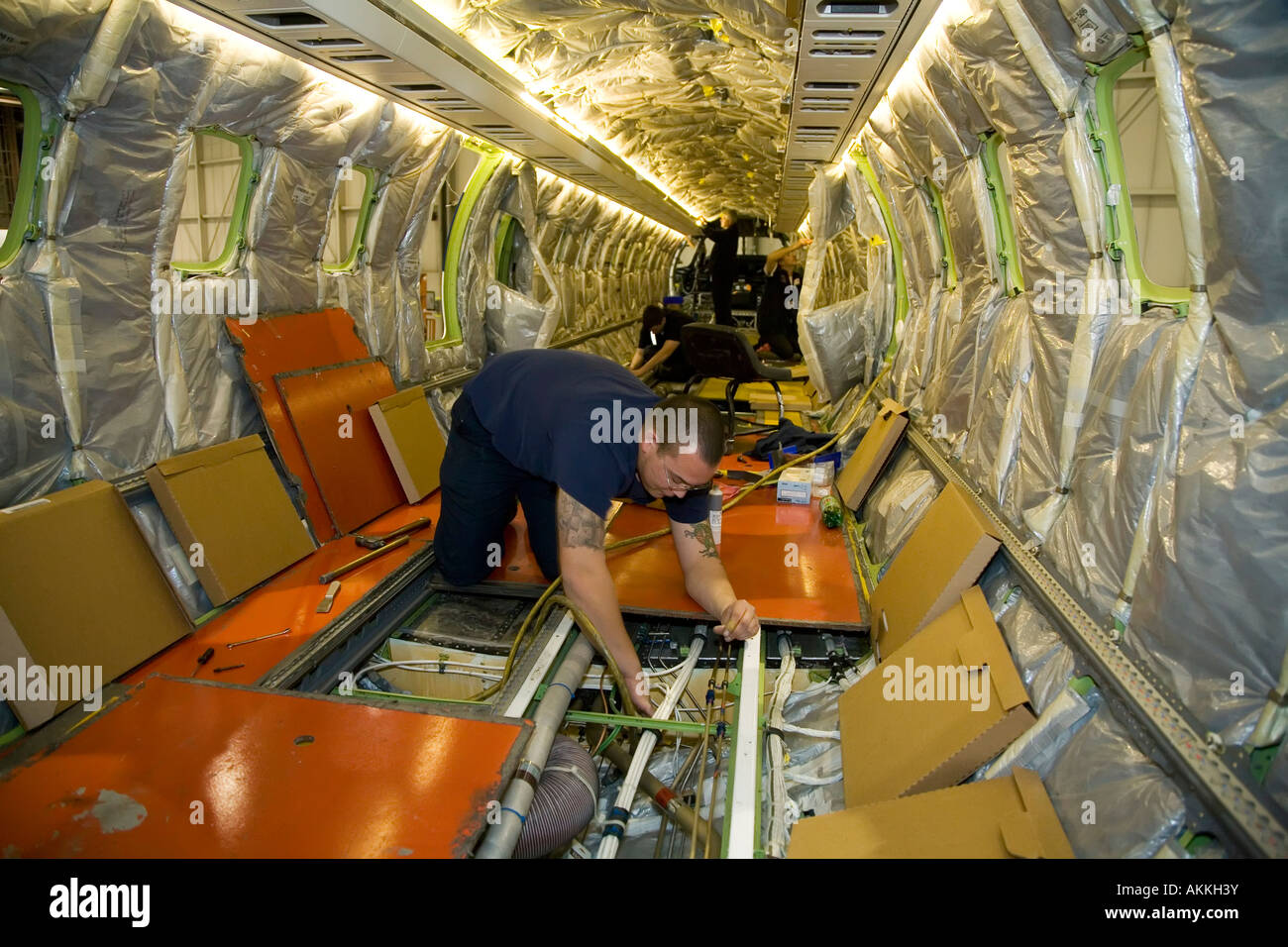 Workers do heavy maintenance on American Eagle Embraer jet airplanes at ...