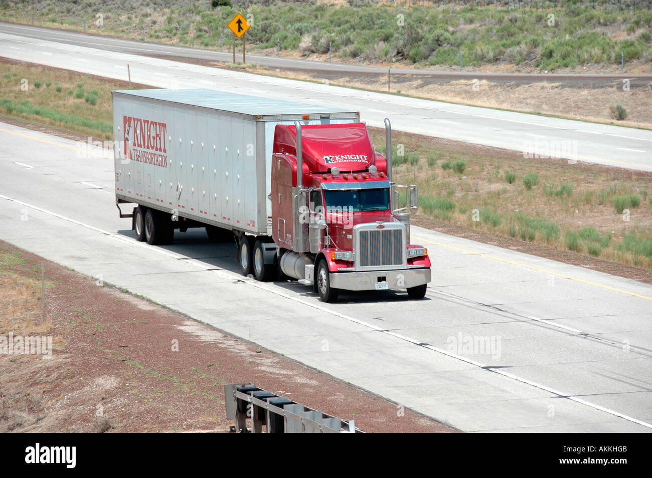Commercial trucks hauling freight on interstate highway in Utah with ...