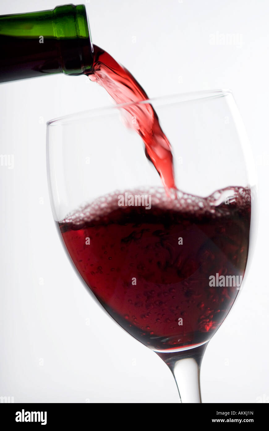 red wine being poured into glass Stock Photo - Alamy