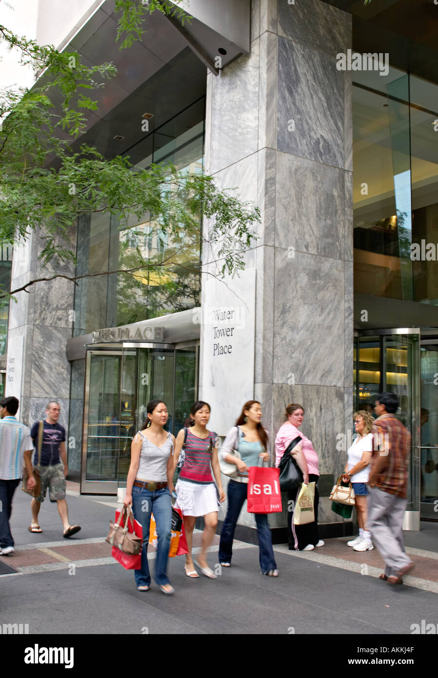 STREET SCENE Chicago Illinois Shoppers walk by Water Tower Place on ...