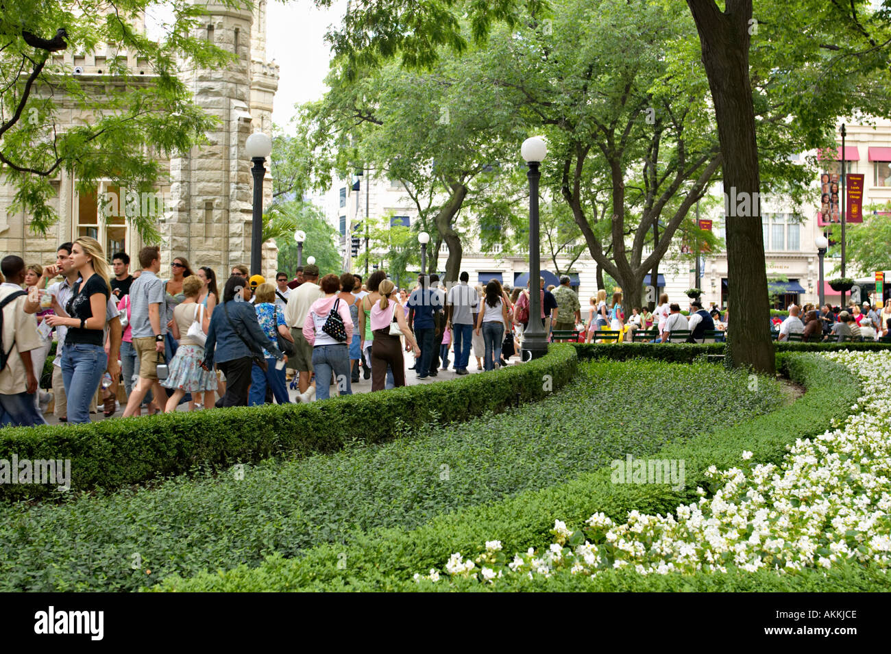 STREET SCENE Chicago Illinois Crowds of people walk by Water Tower park ...