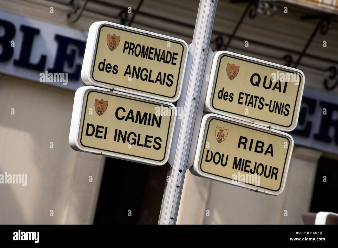 A street sign on the Promenade des Anglais in French and in Nissart ...
