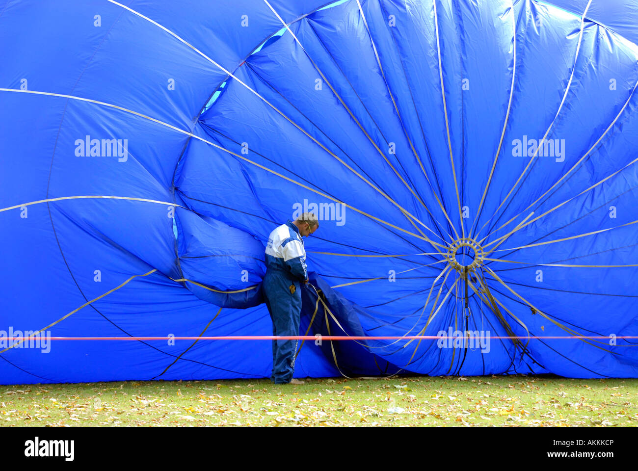 Inflating a blue hot air balloon Stock Photo - Alamy