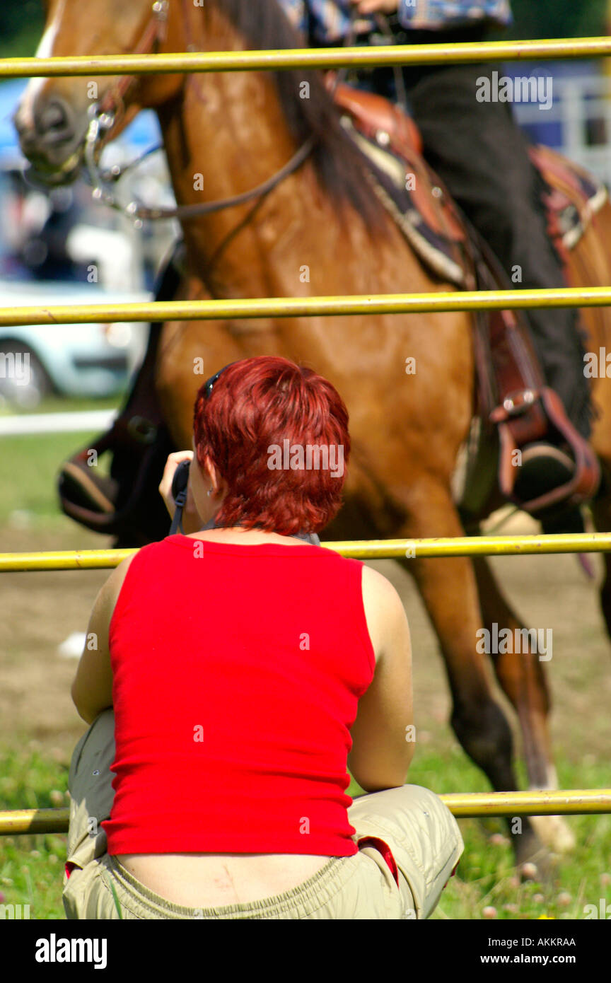 Girl watching horse rodeo Stock Photo - Alamy