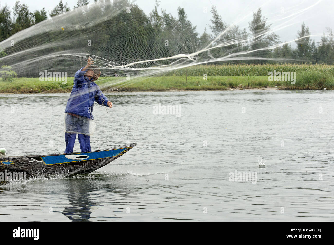 Woman casting net hi-res stock photography and images - Alamy