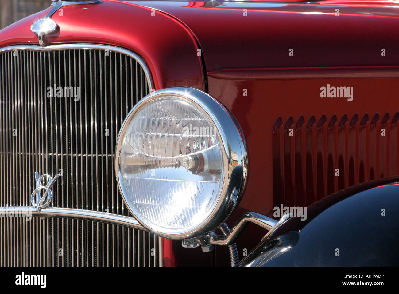 The front view of a red antique car with a black tire fin Stock Photo ...