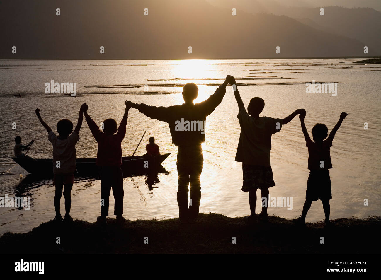 A group of people with arms raised Stock Photo - Alamy