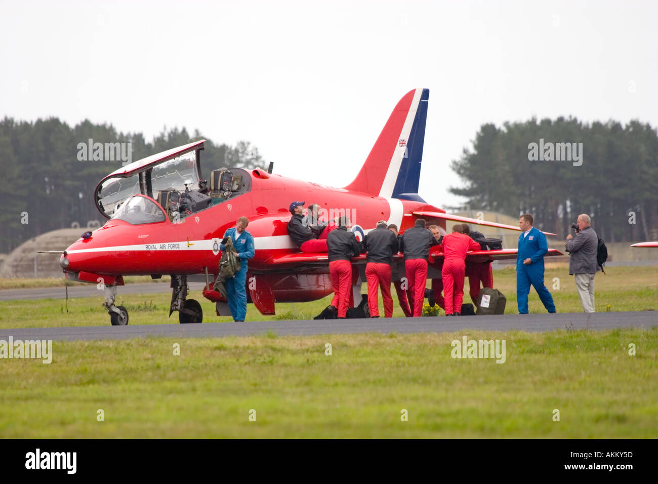 RAF Red Arrows display team crew relax around BAE Hawk jet trainer ...