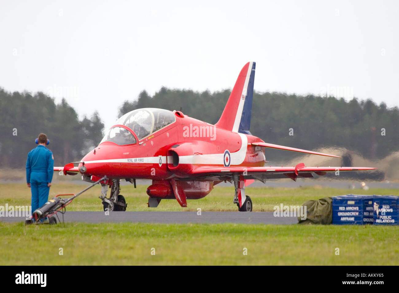 RAF Red Arrows maintenance engineer stands in front of BAE Hawk jet ...
