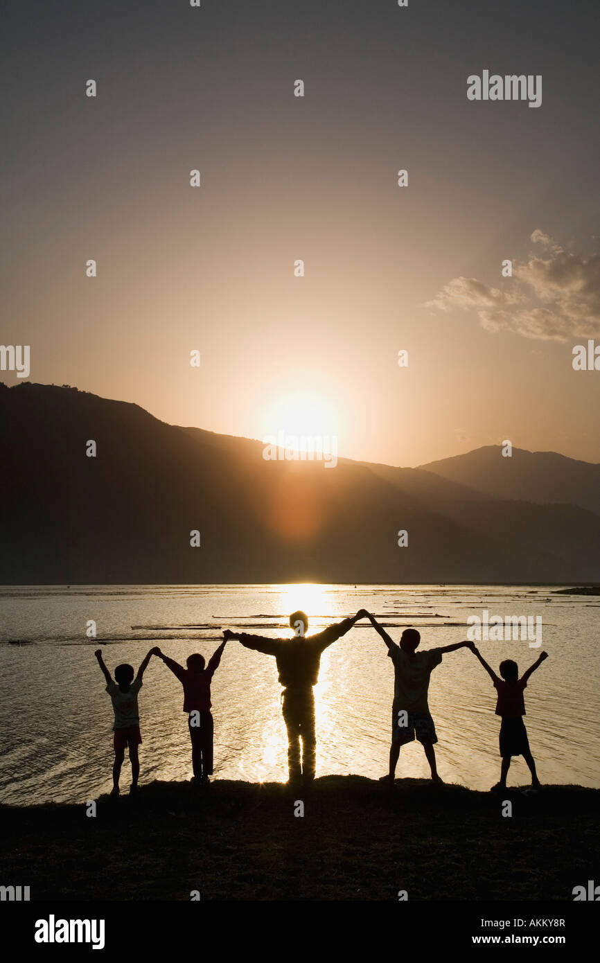 A group of people raising their hands Stock Photo - Alamy