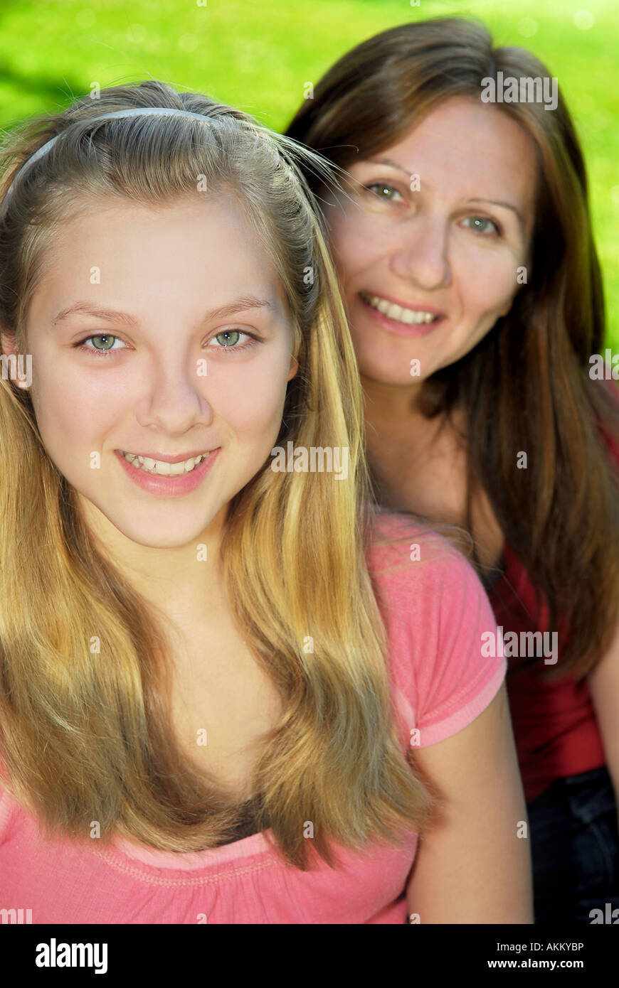 Portrait of smiling family of mother and her teenage daughter Stock ...