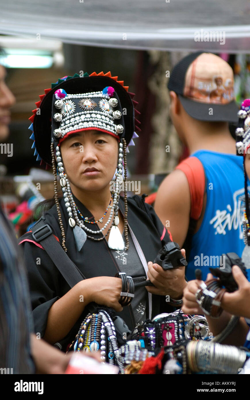 Khao San Road street-trader in Akha tribal costume Stock Photo - Alamy