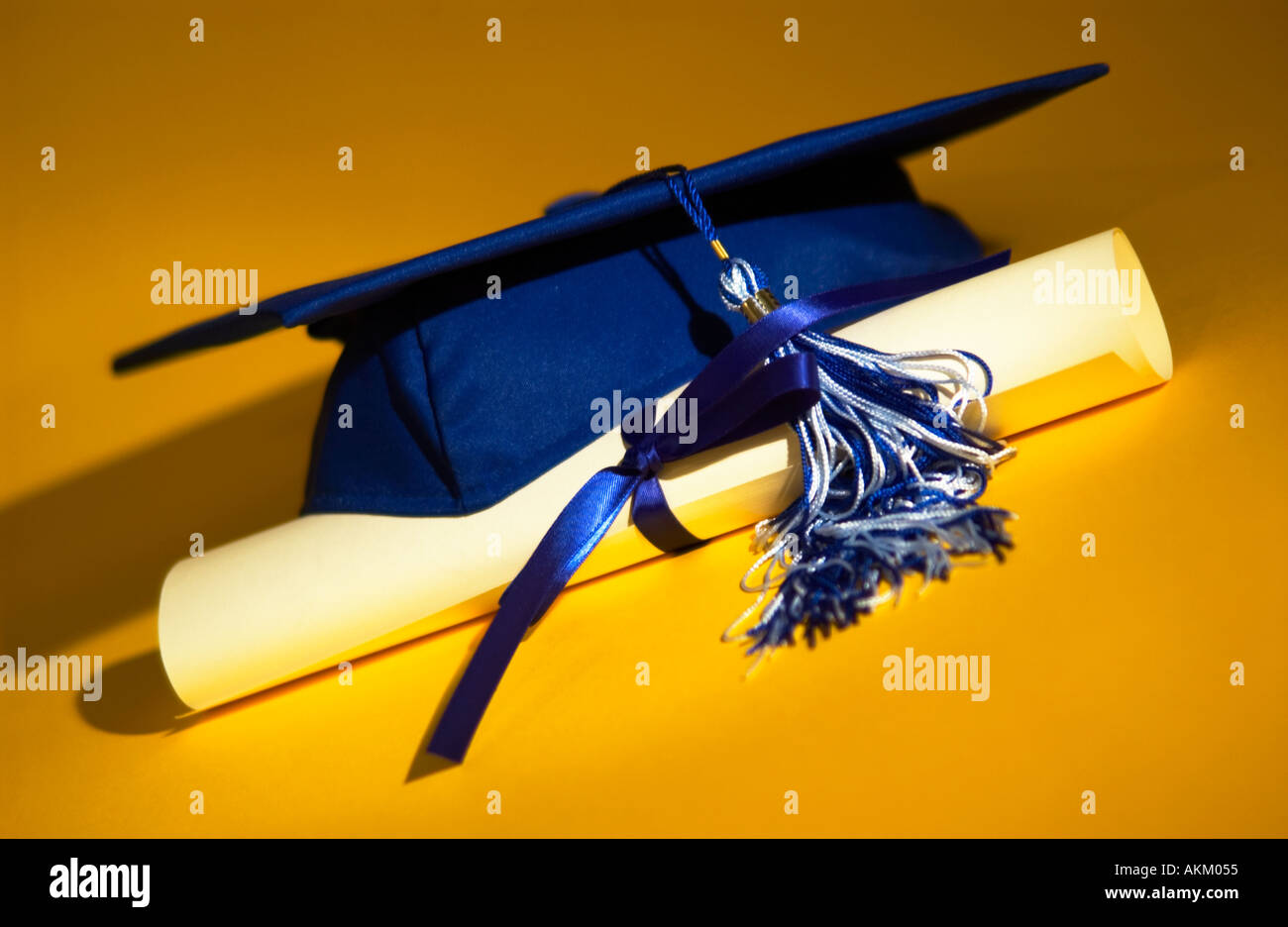Graduation cap and diploma Stock Photo - Alamy