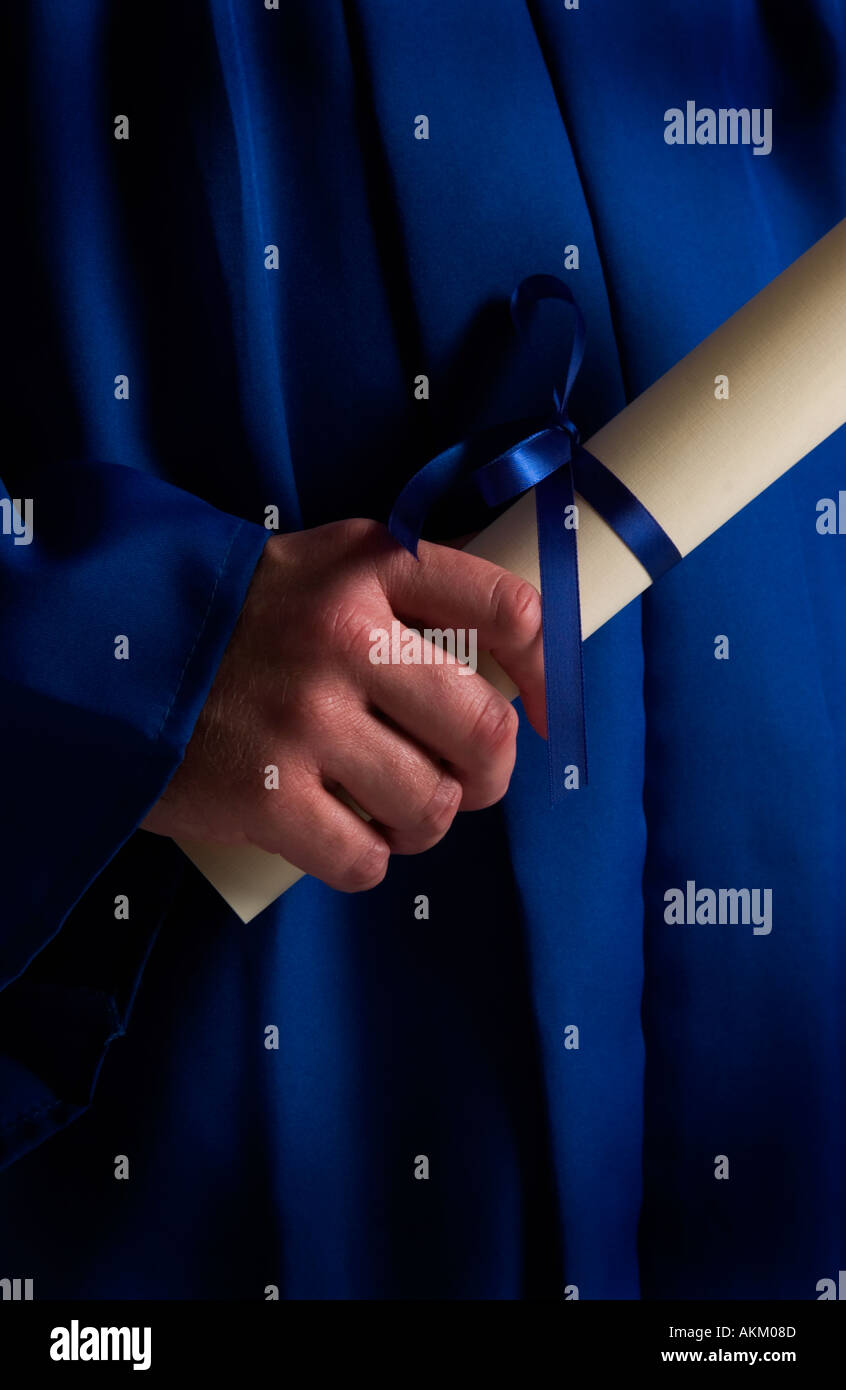 Graduate holding diploma Stock Photo - Alamy