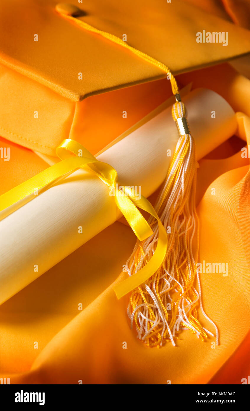 Graduation cap gown and diploma Stock Photo - Alamy