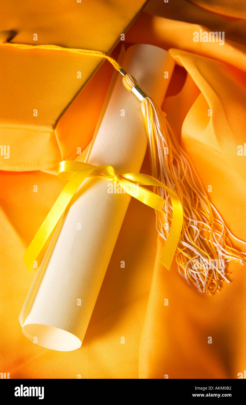 Graduation cap gown and diploma Stock Photo - Alamy
