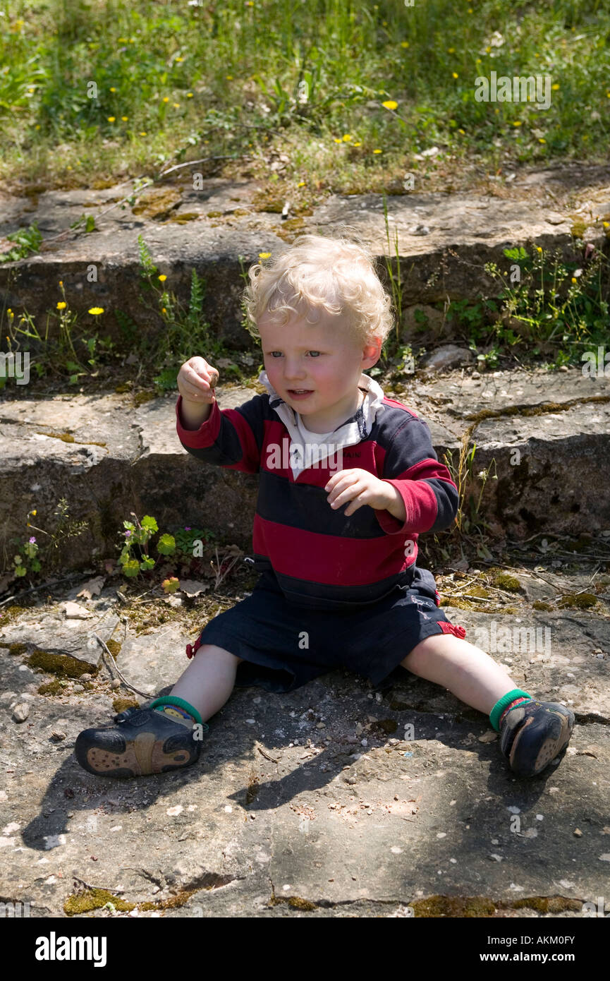 a boy playing outside Stock Photo - Alamy