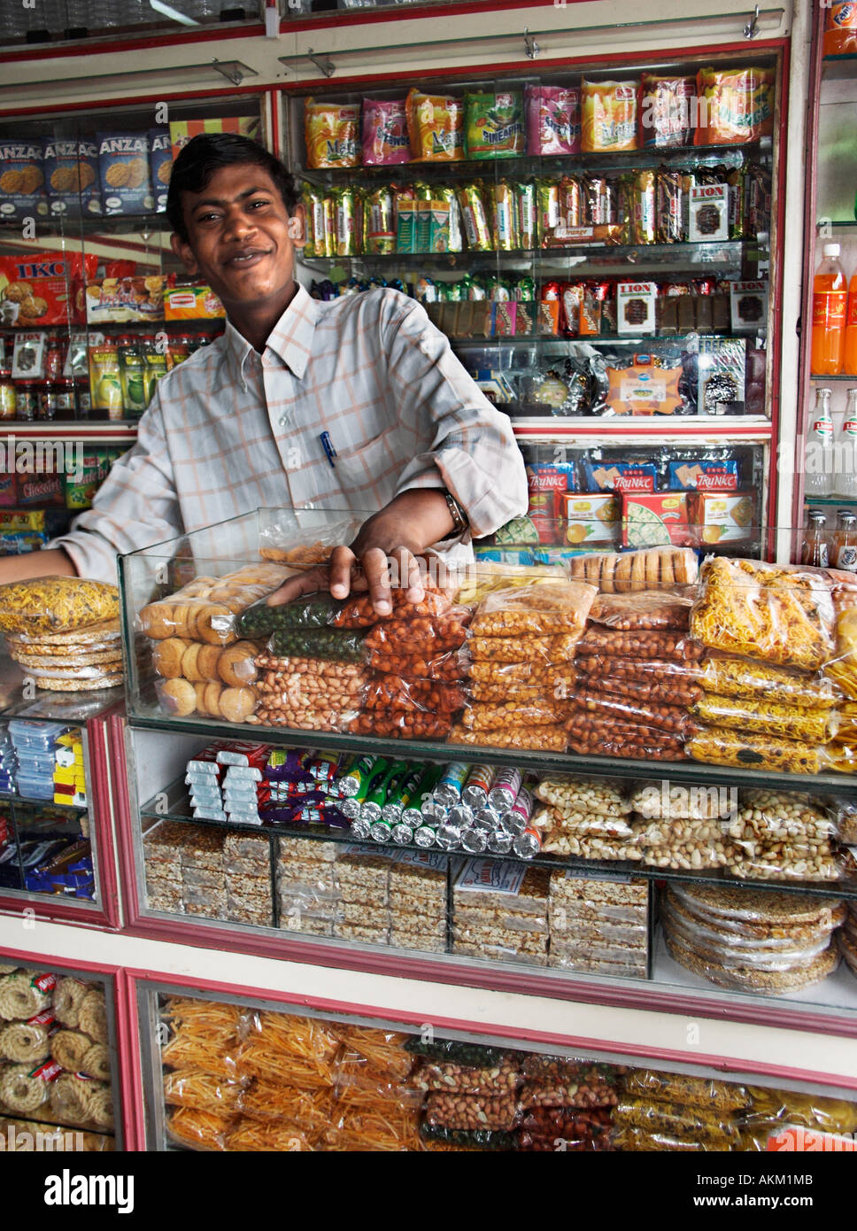 Indian man behind counter in general store Chennai Madras India Stock ...