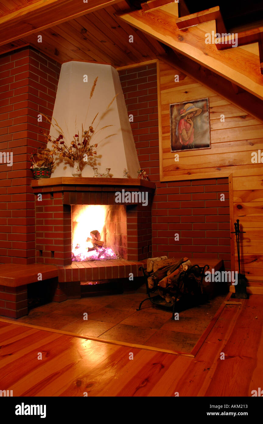 Fireplace in wooden house Stock Photo - Alamy