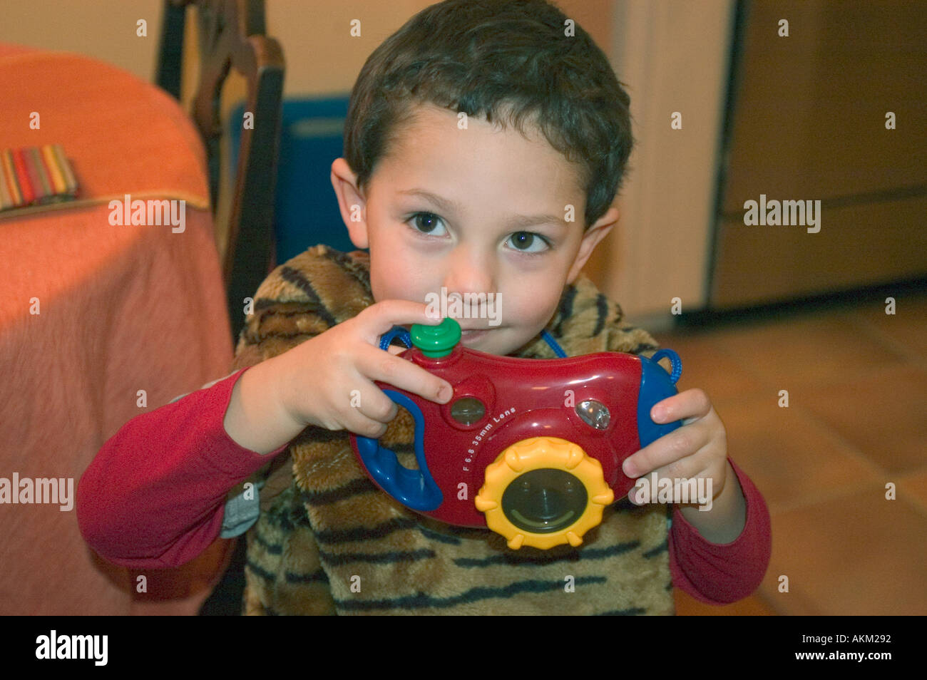 BOY, Age Three, PLAYS WITH TOY CAMERA Stock Photo - Alamy