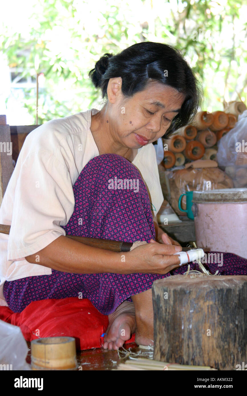 Woman working on one of the umbrella s in the umbrella factory in ...