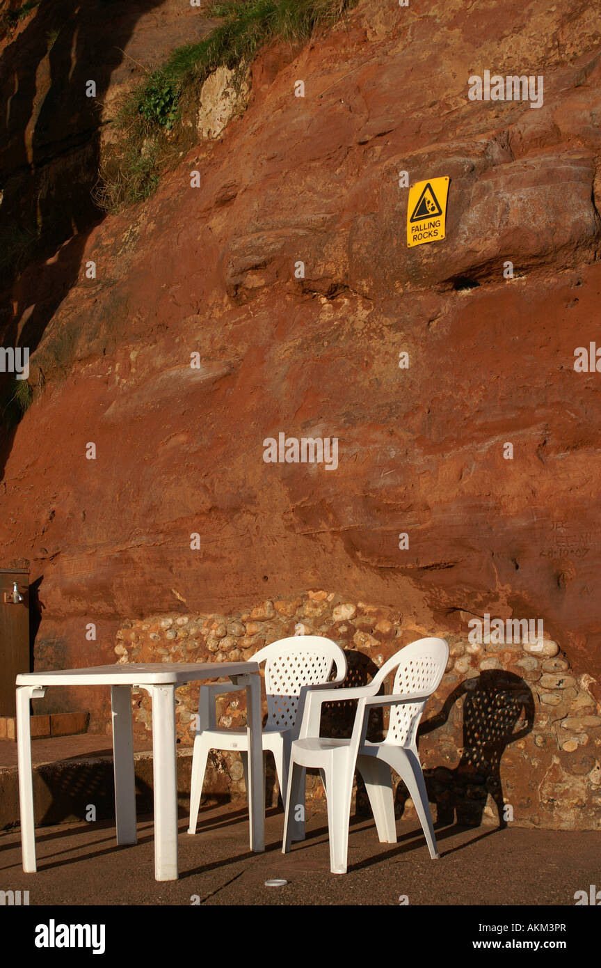 White Chairs under Falling Rock Sign Sidmouth Red Yellow Stock Photo ...