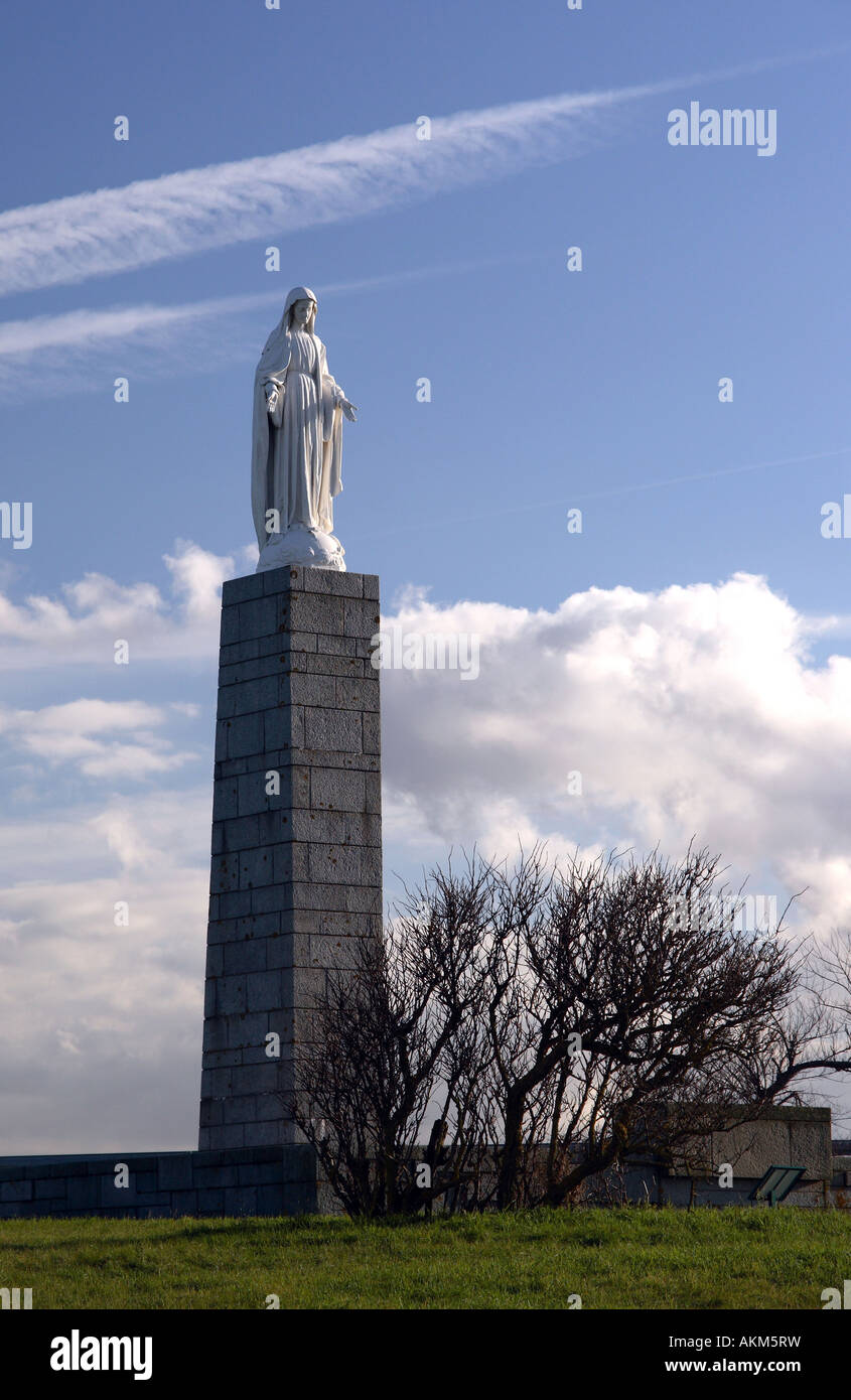 The statue of the Virgin Mary overlooking Arromanches in Normandy ...