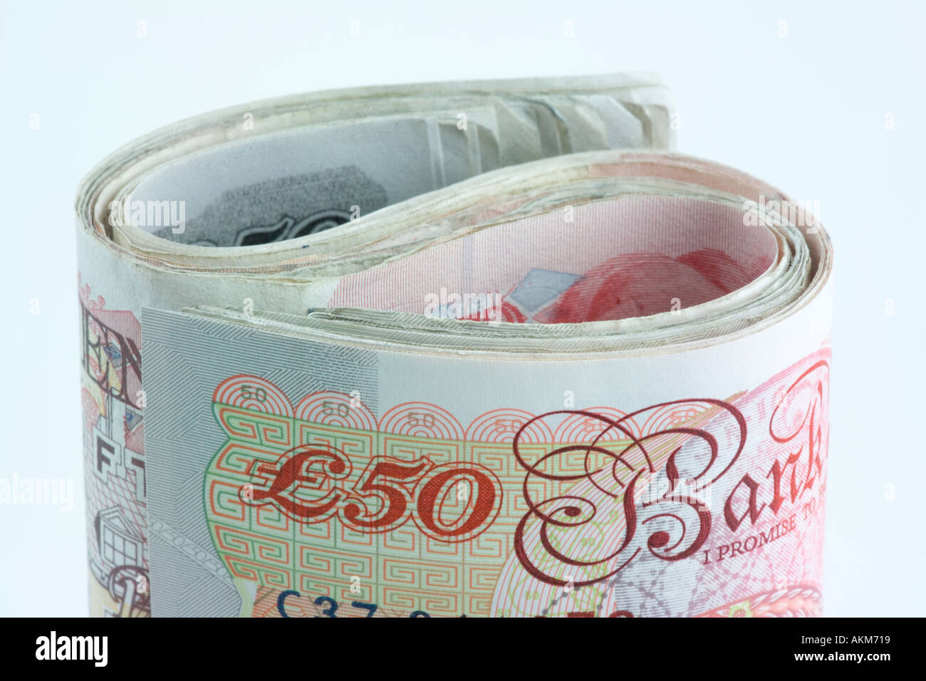 Roll of fifty pound notes Stock Photo - Alamy