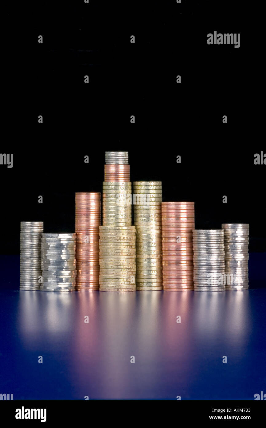 Stacks of British coins black background Stock Photo - Alamy