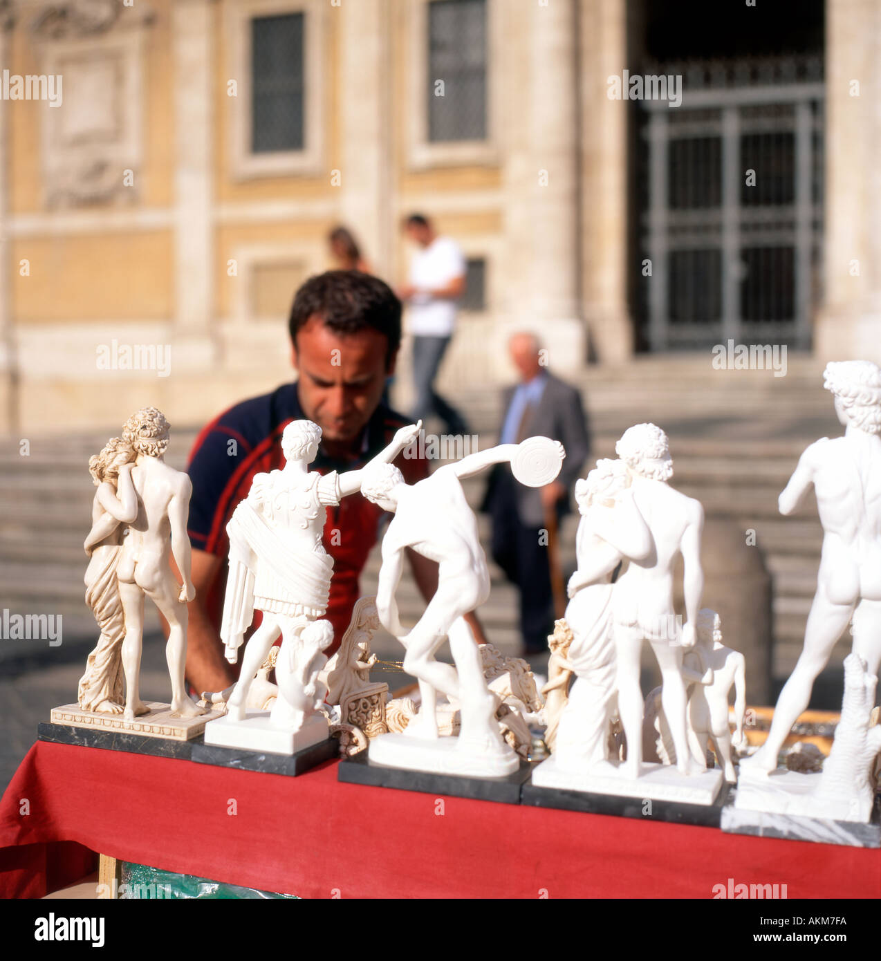A Roman merchant selling miniature classical art statues of figures ...